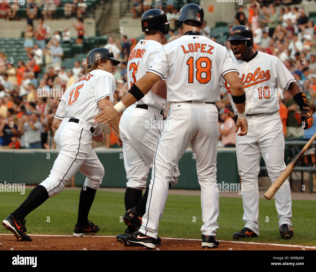 The Baltimore Orioles Jay Gibbons (31) is congratulated by Eric Byrnes ...