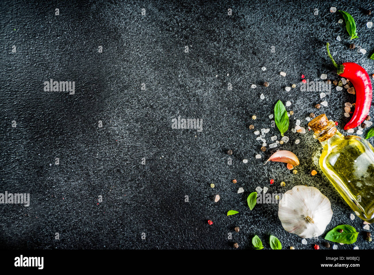 Cooking food stone concrete background with spices, olive oil, garlic ...