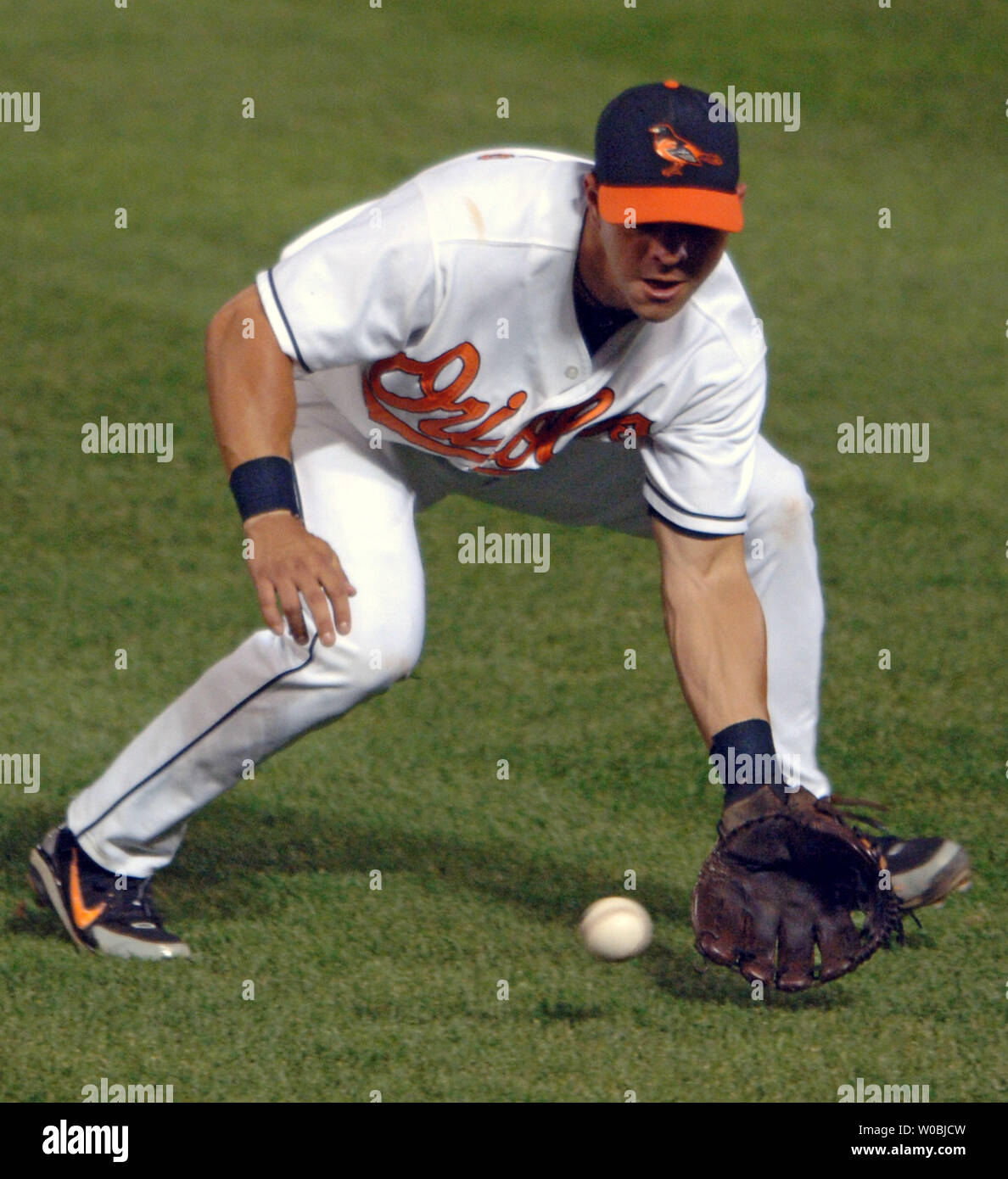 The Baltimore Orioles Brian Roberts fields grounder hit by the Los ...