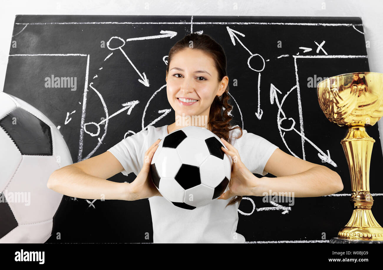 Beautiful European young cheerful happy woman, football fan or player ...