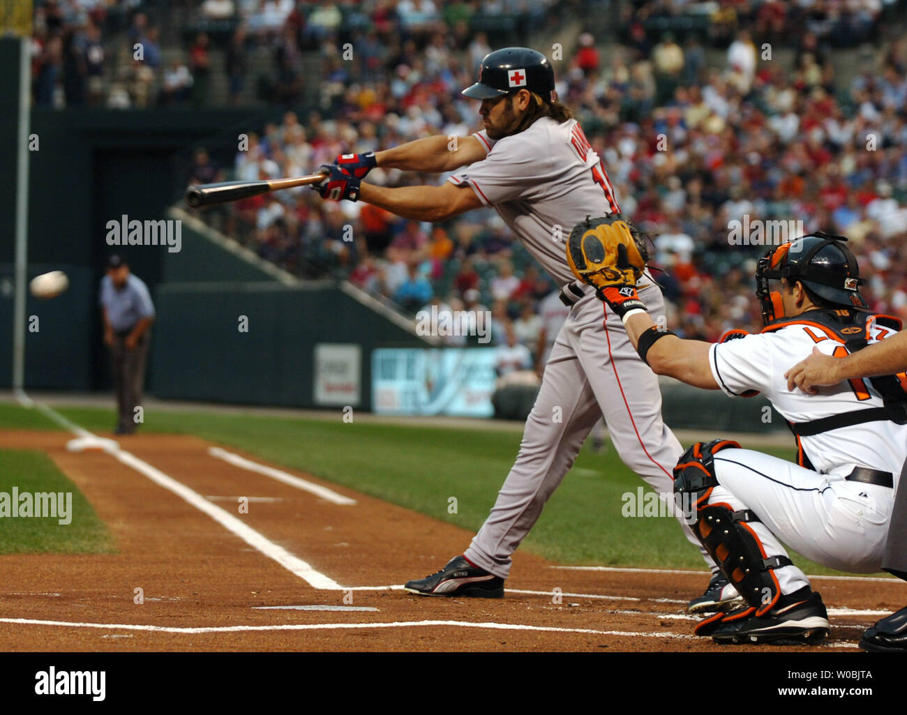 The Boston Red Sox Johnny Damon hits a single in the top of the first ...