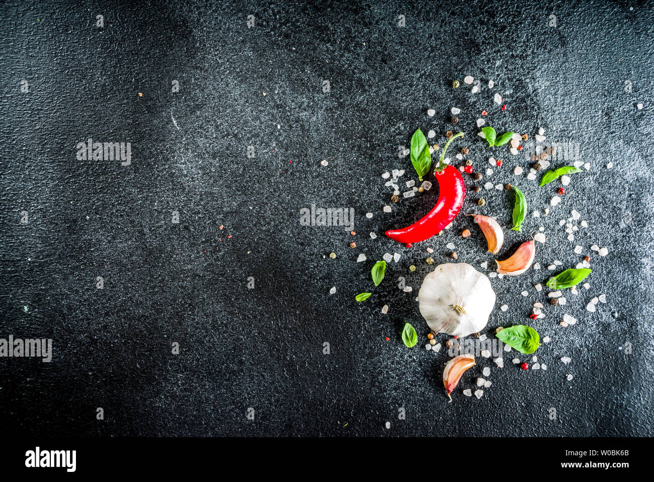 Cooking food stone concrete background with spices, olive oil, garlic ...