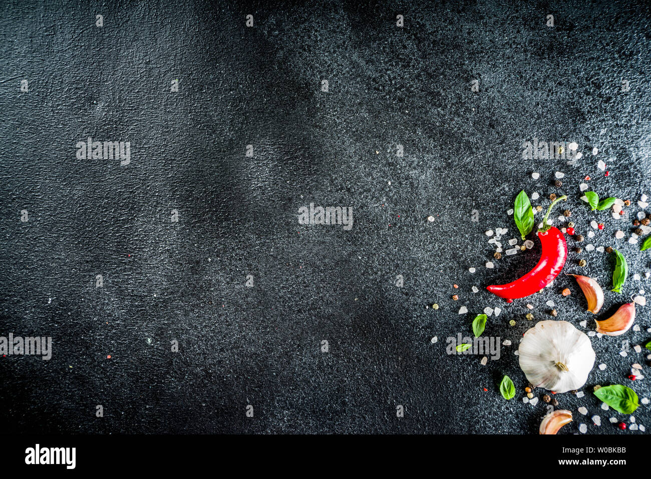 Cooking food stone concrete background with spices, olive oil, garlic ...