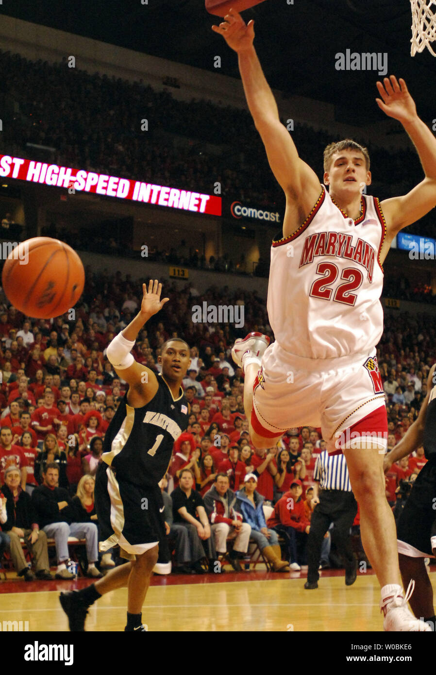 Nik Caner-Medley of the Maryland Terrapins goes to the basket and is ...