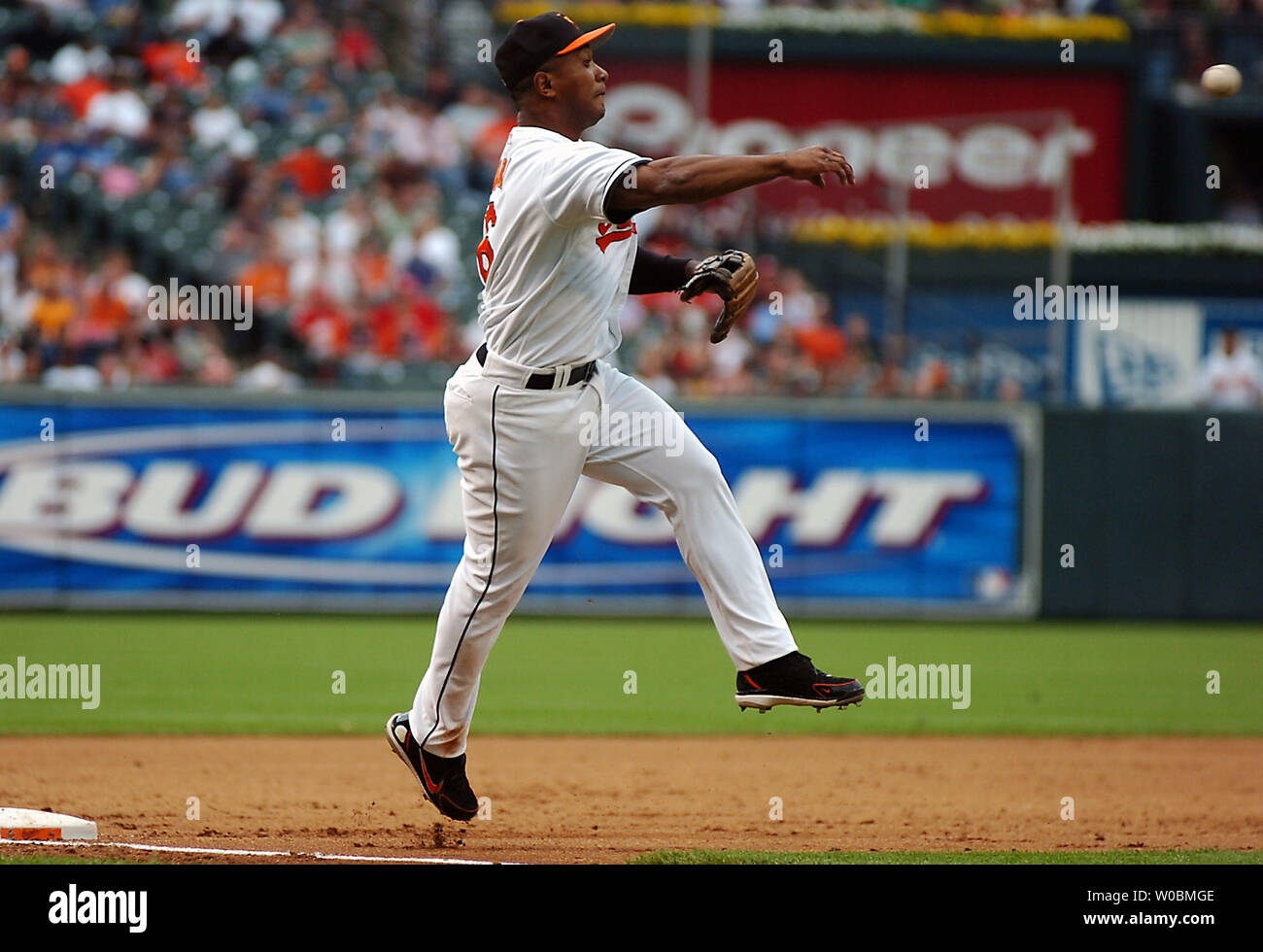 The Baltimore Orioles Melvin Mora (6) fields a slow roller and throws ...