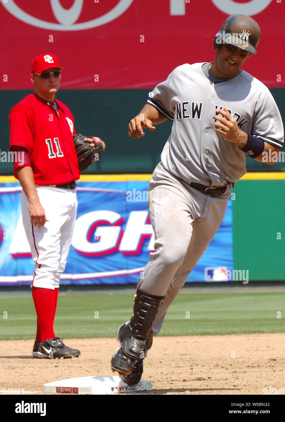 The New York Yankees catcher Jorge Posada (20) rounds thrid base after ...