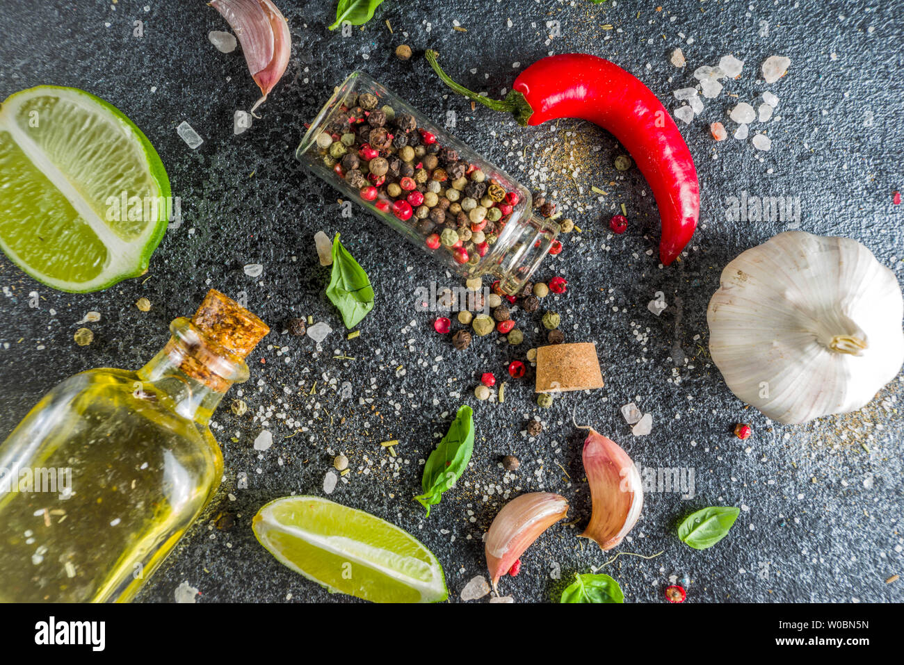 Cooking food stone concrete background with spices, olive oil, garlic ...