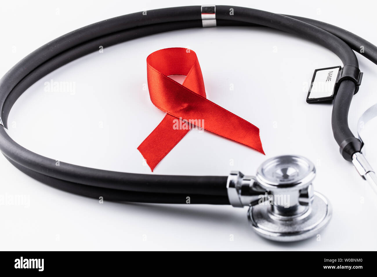 AIDS prevention red ribbon Stock Photo - Alamy