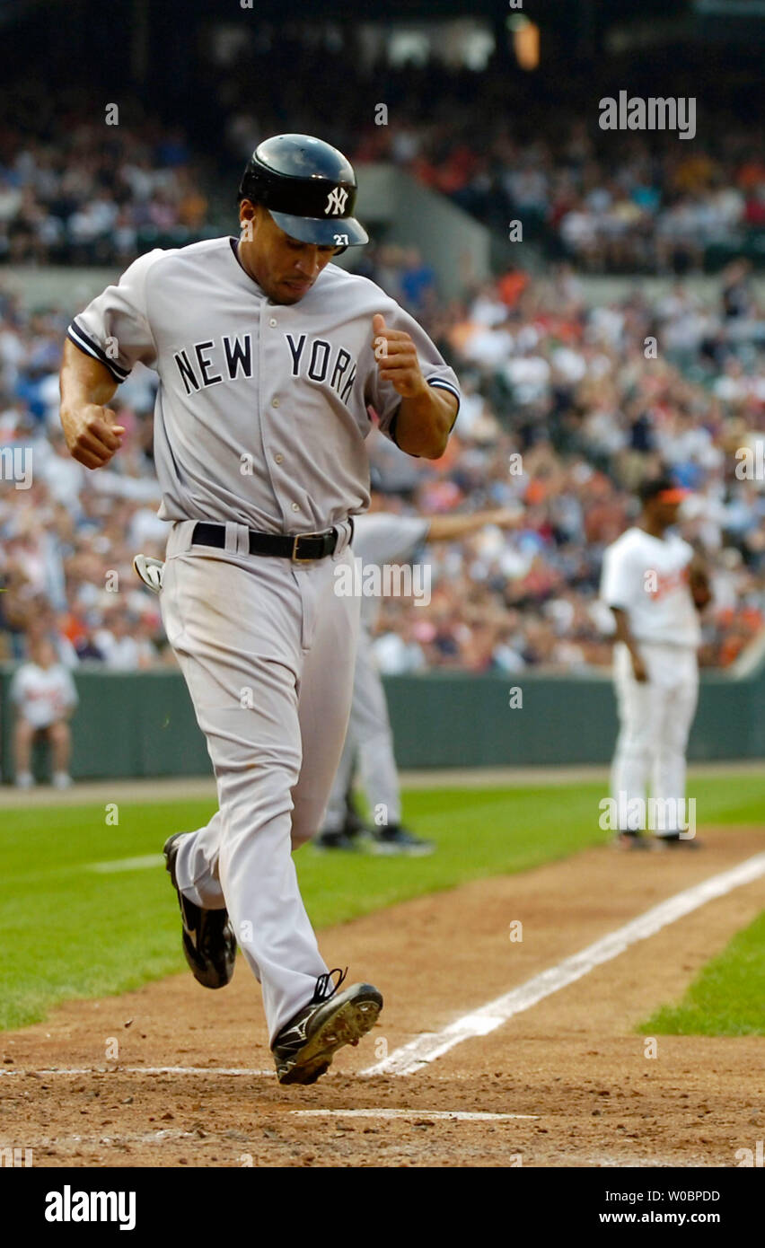 The New York Yankees Kevin Thompson (27) scores the first run of the ...