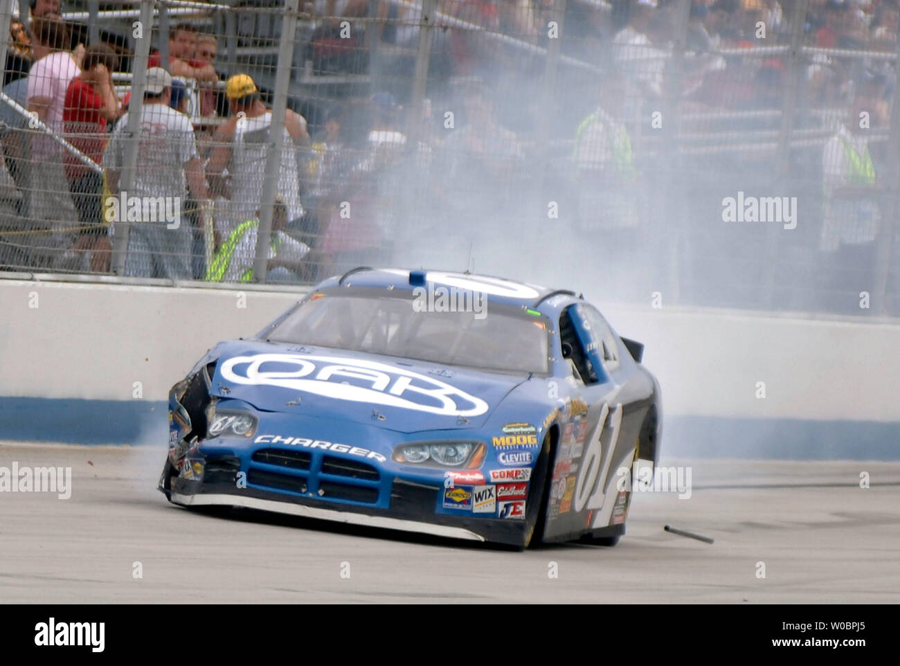The car of Stanton Barrett (61) hits the wall out of turn four in the ...