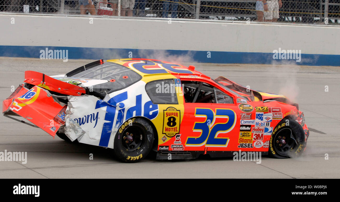 Travis Kvapil (32) crashes his car coming out of turn four in the ...