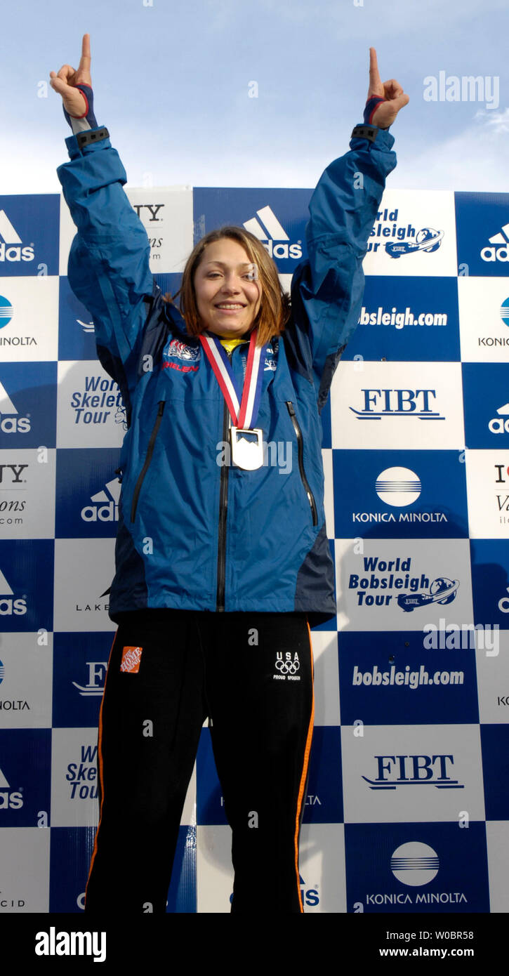 Katie Uhlaender of the United States raises her arms and smiles on the ...