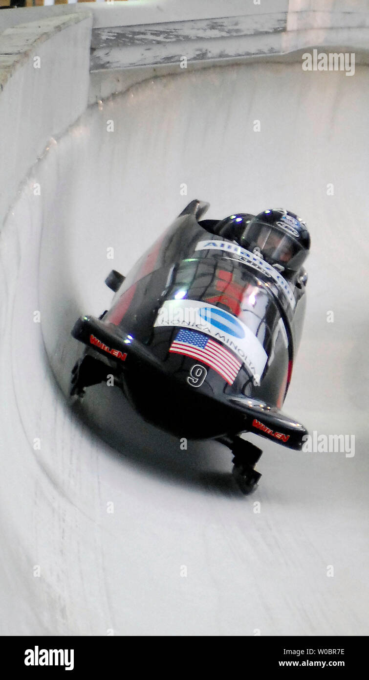 Steven Holcomb in the United States-1 sled drives a 4-man bobsled with ...