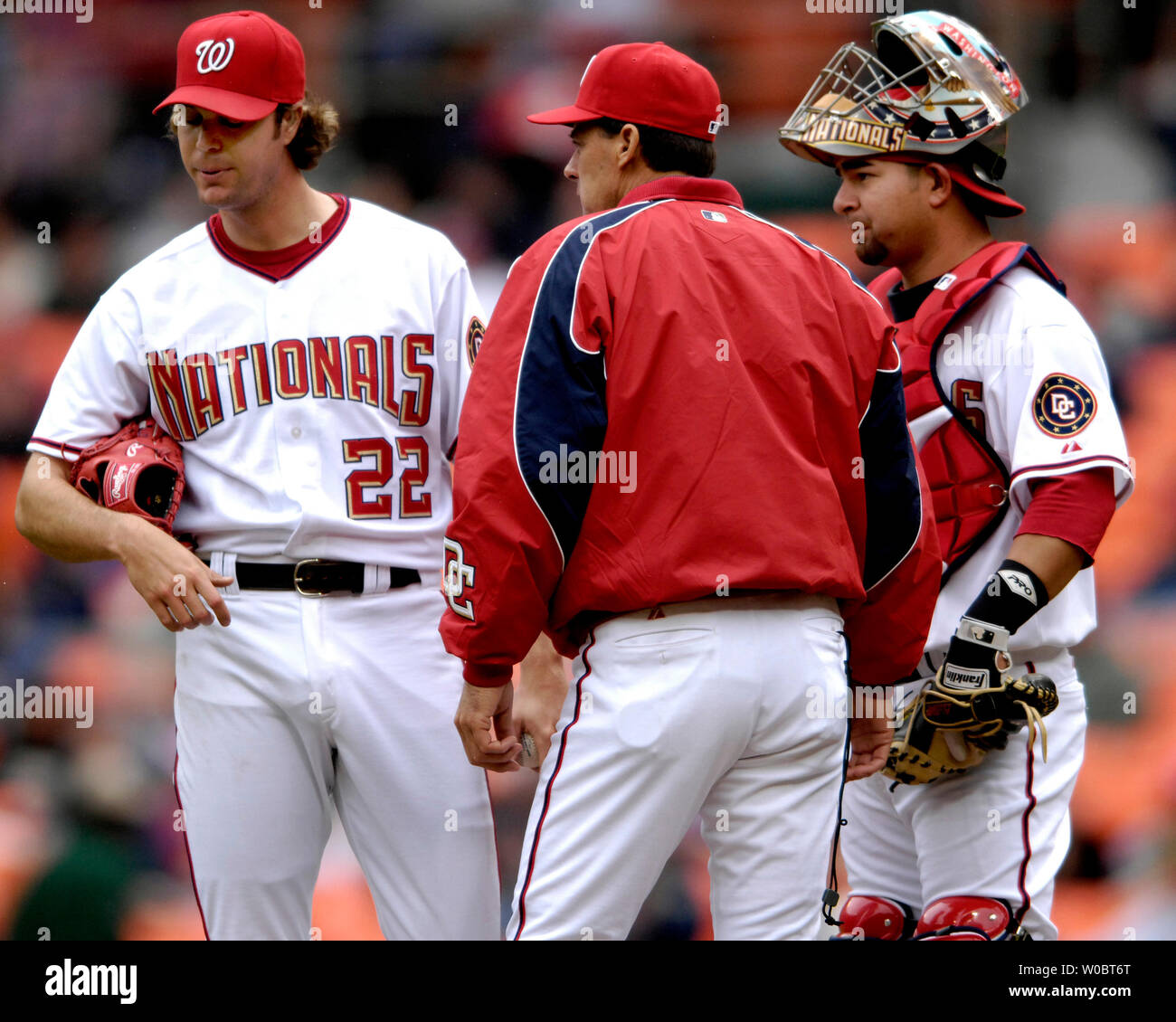 Washington Nationals pitching coach Randy St. Claire (C) comes out to ...