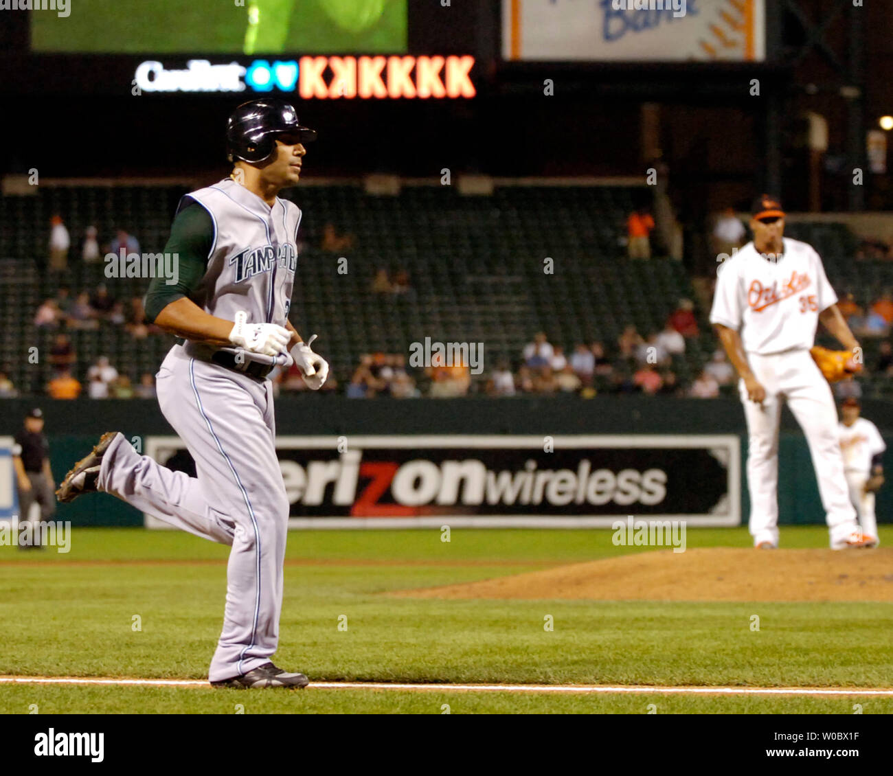 Tampa Bay Devil Rays first baseman Carlos Pena (23) rounds the bases ...