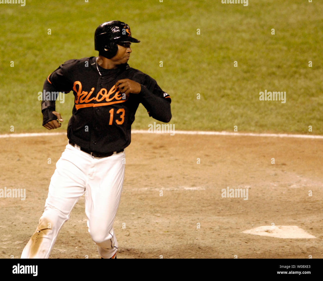 Baltimore Orioles center fielder Tike Redman scores the winning run in ...
