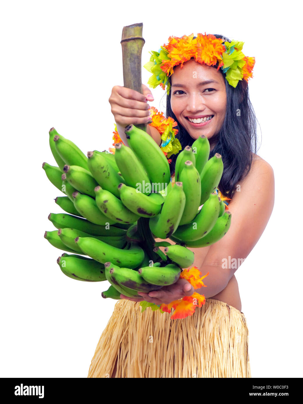 Hawaii Hula Dancer carries bunch of green bananas, isolated on white ...