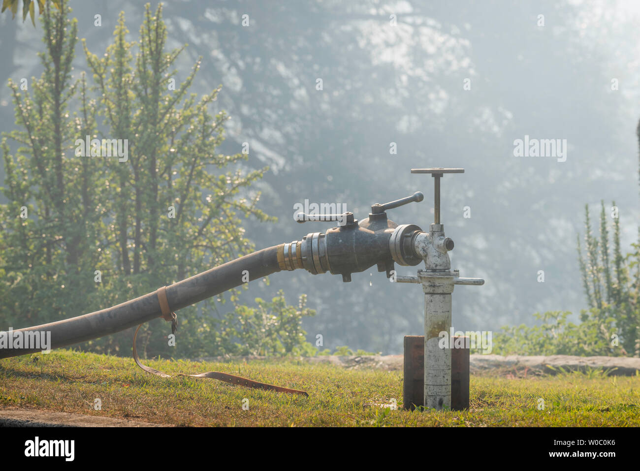A tap or valve with a fire hose attached and connected to an Australian ...