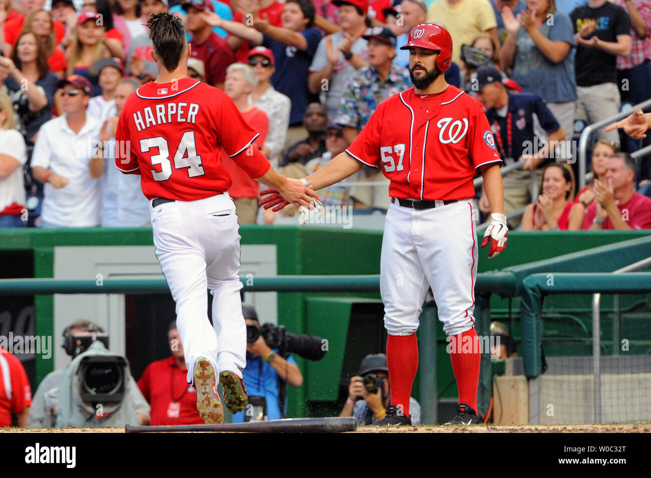 Washington Nationals left fielder Bryce Harper (34) is congratulated by ...