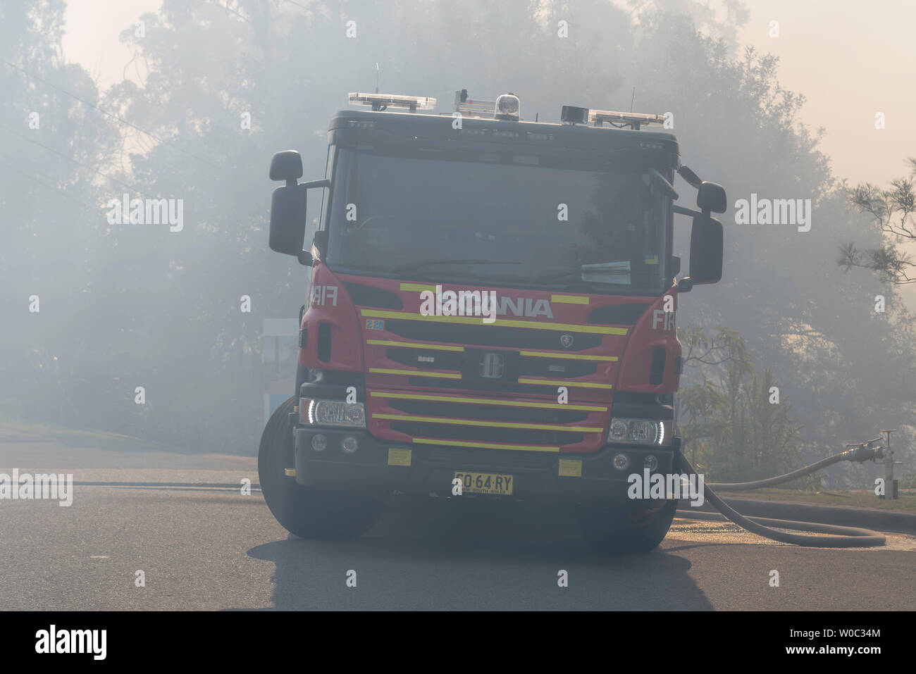 A New South Wales Fire and Rescue truck with fire hoses connected ...