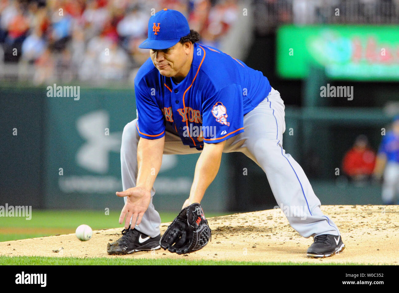 New York Mets starting pitcher Bartolo Colon (40) fields a ball against ...
