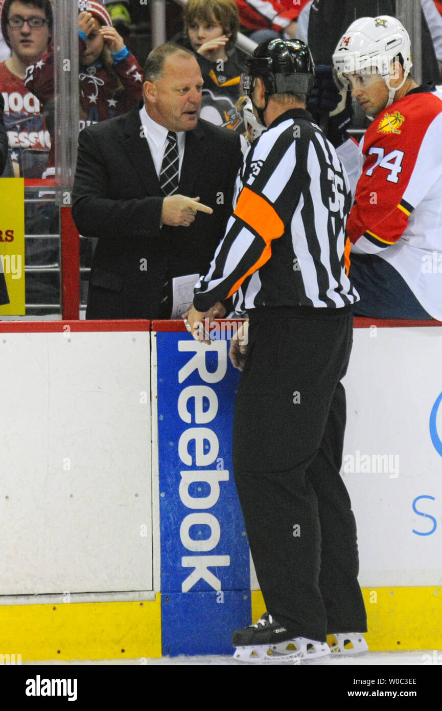 Florida Panthers head coach Gerard Gallant (L) has words with referee ...