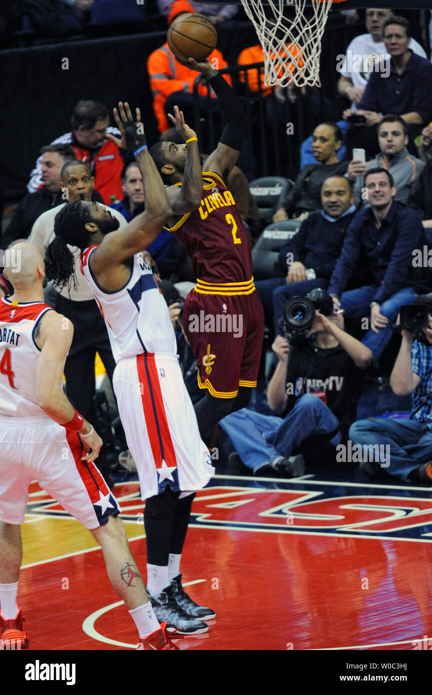 Cleveland Cavaliers guard Kyrie Irving (2) scores against Washington Wizards forward Nene ...