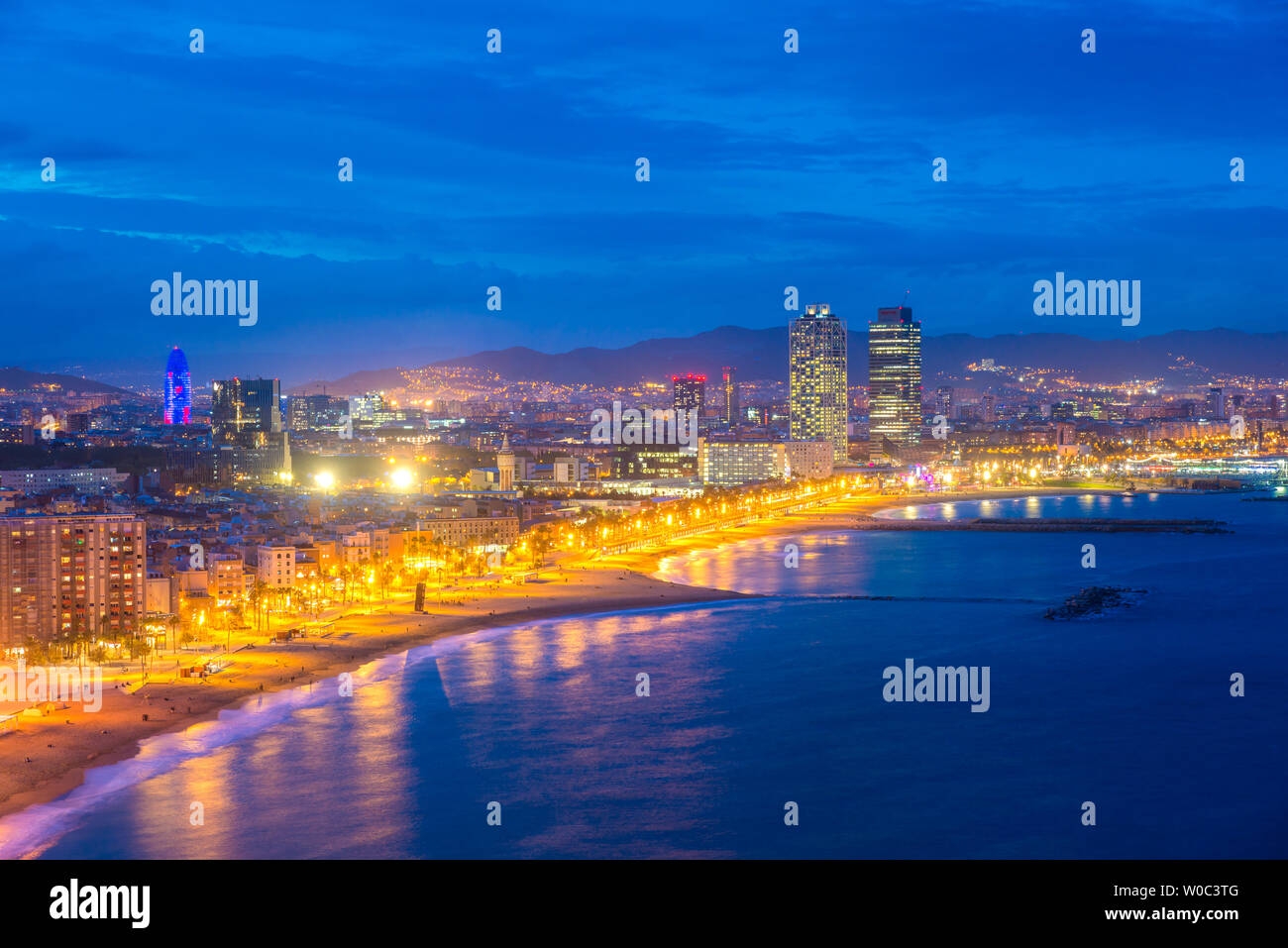 Aerial view of Barcelona Beach in summer night along seaside in ...