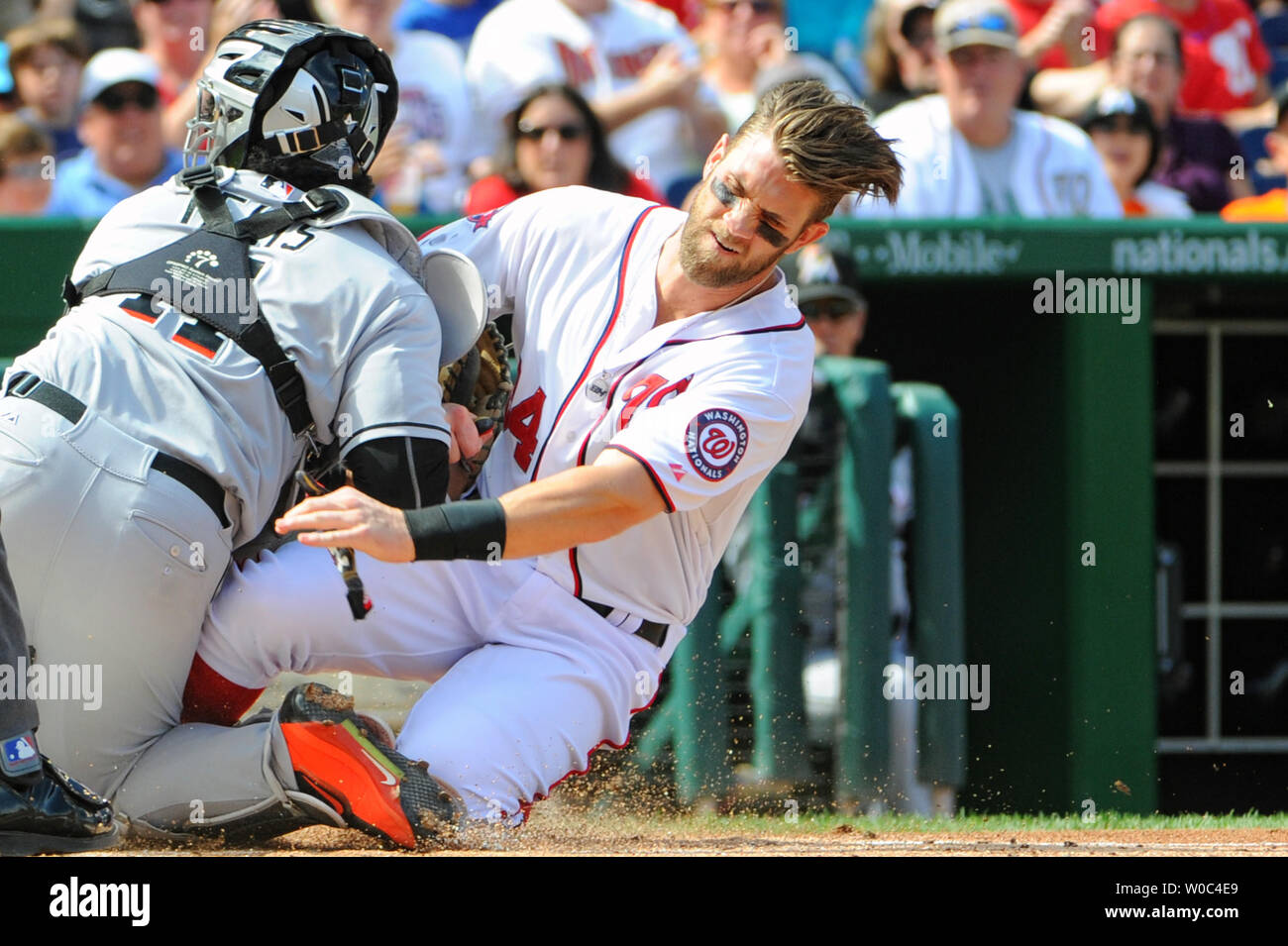 Washington Nationals right fielder Bryce Harper (34) slides safely home ...