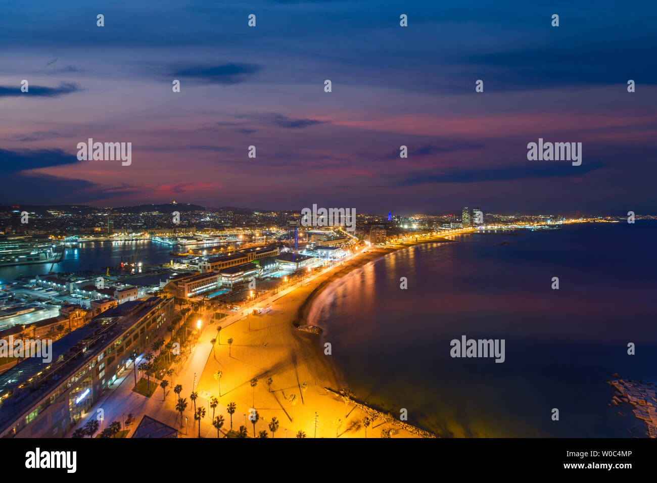 Aerial view of Barcelona Beach in summer night along seaside in ...