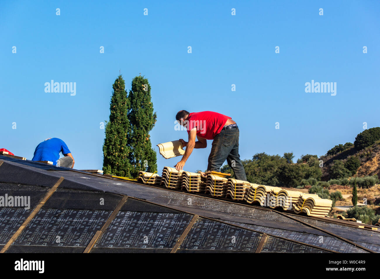 Roofing construction contractor installing hi-res stock photography and ...