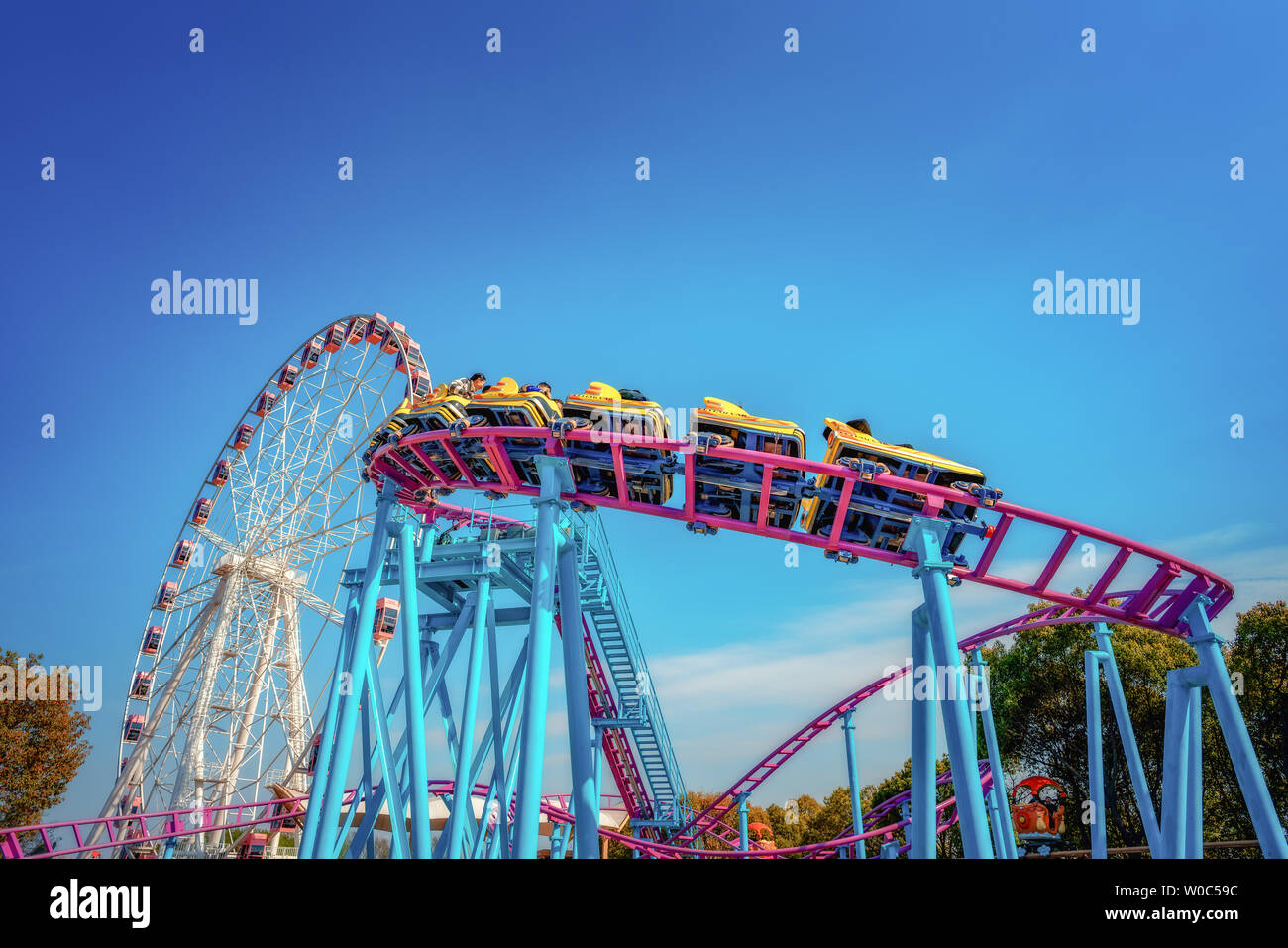 Ferris wheels and roller coasters Stock Photo - Alamy