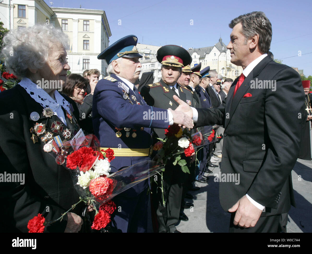 Ukraine President Victor Yushchenko (R) greets veterans of War World II ...