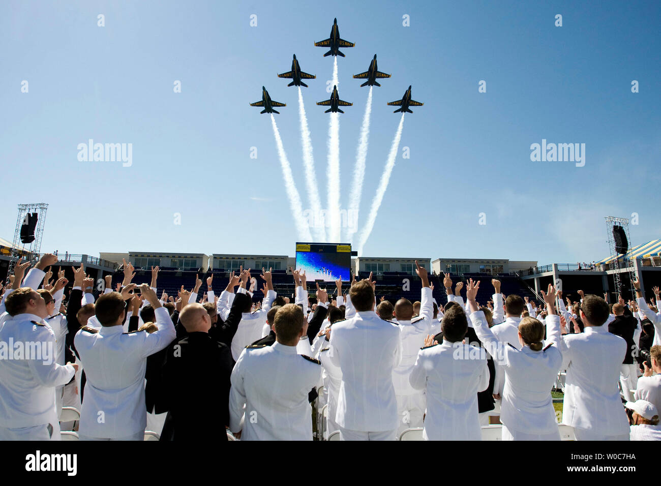 Midshipmen cheer as the Navy Blue Angels fly over Navy-Marine Corp ...