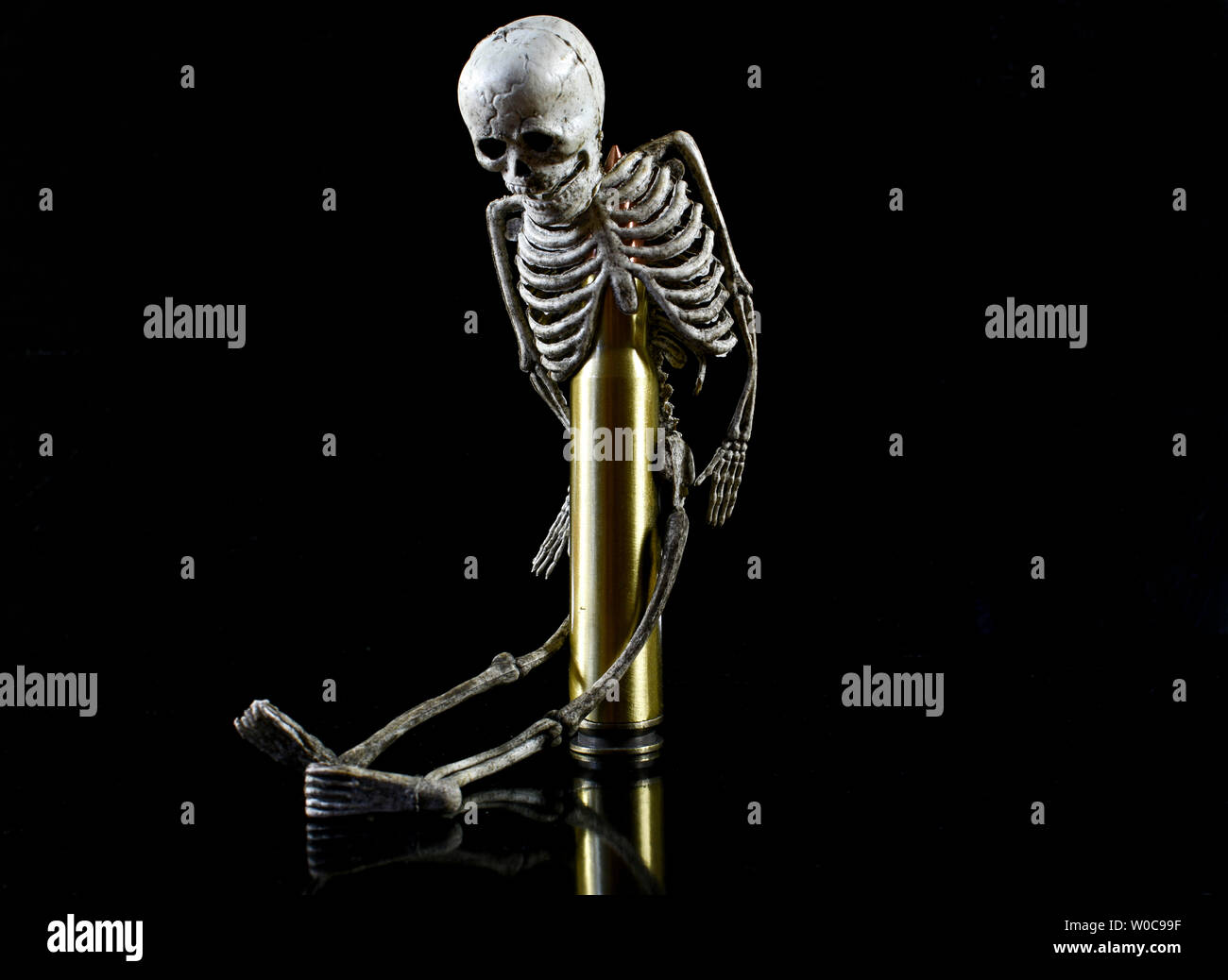 Human like rubber skeleton with a high caliber bullet between it's ribs ...