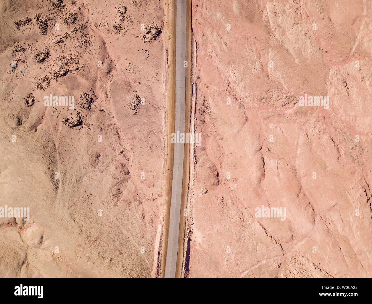 Old Desert road with cracked asphalt, Top down aerial image Stock Photo ...