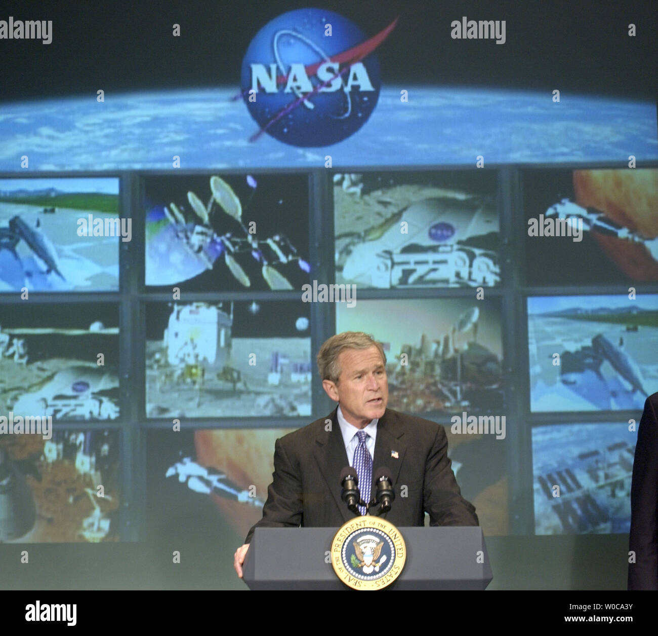 President George W. Bush addresses those gathered at NASA headquarters ...