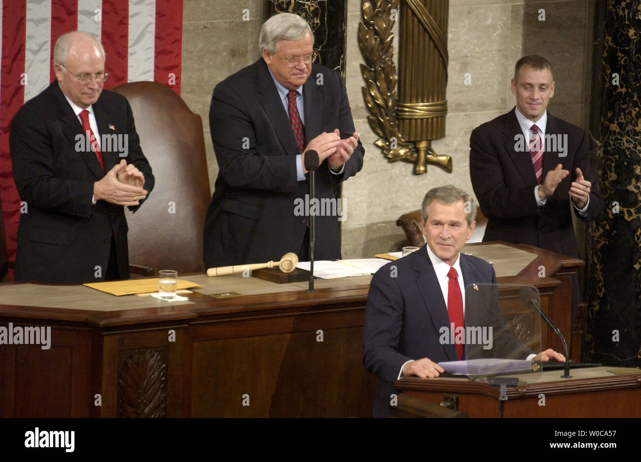President George W. Bush is applauded by Vice President Dick Cheney ...
