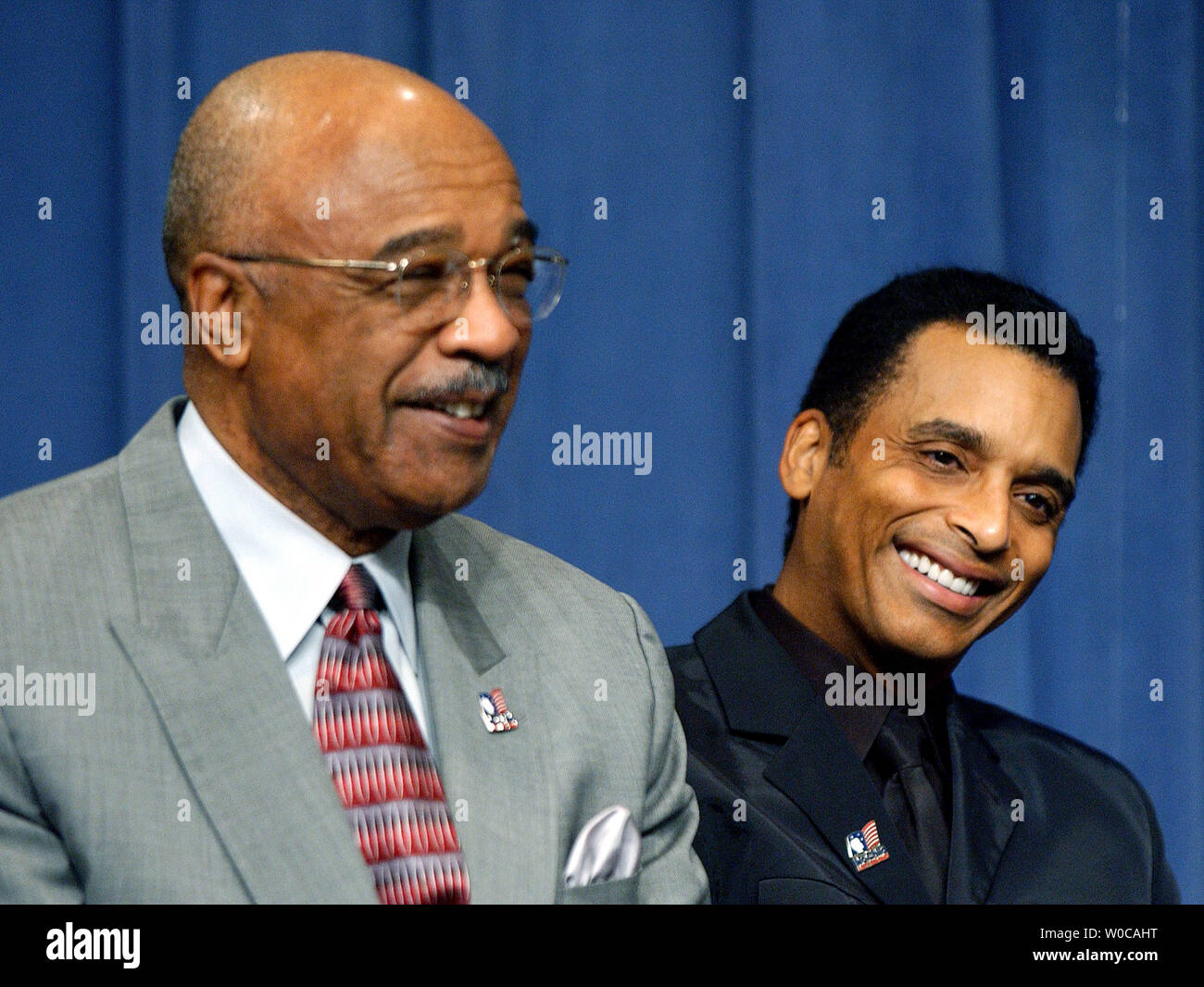 Secretary of Education Rod Paige, left, and Latino singer Jon Secada ...