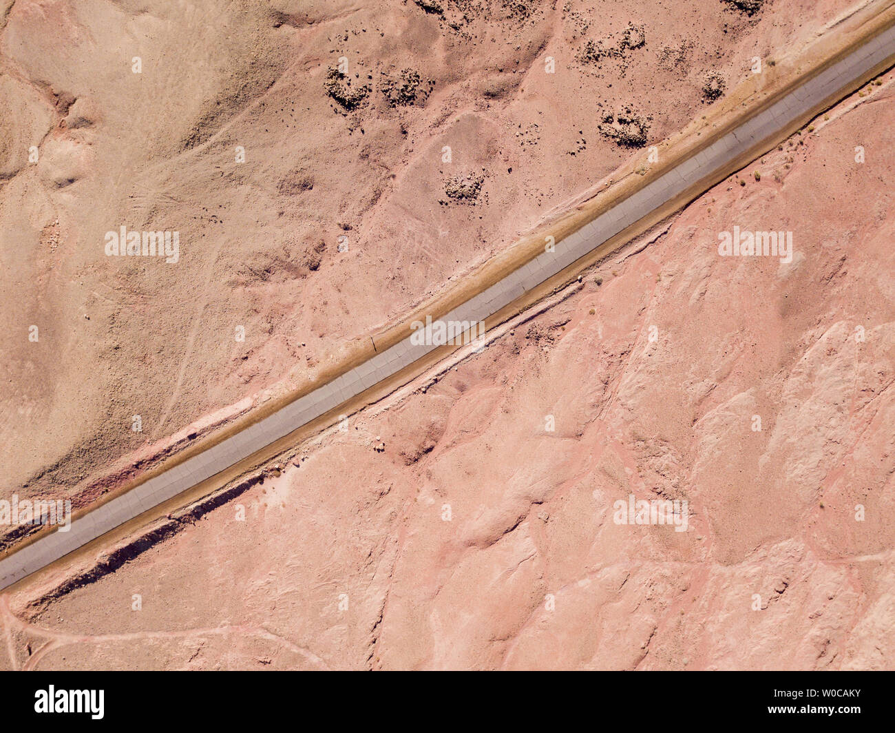 Old Desert road with cracked asphalt, Top down aerial image Stock Photo ...