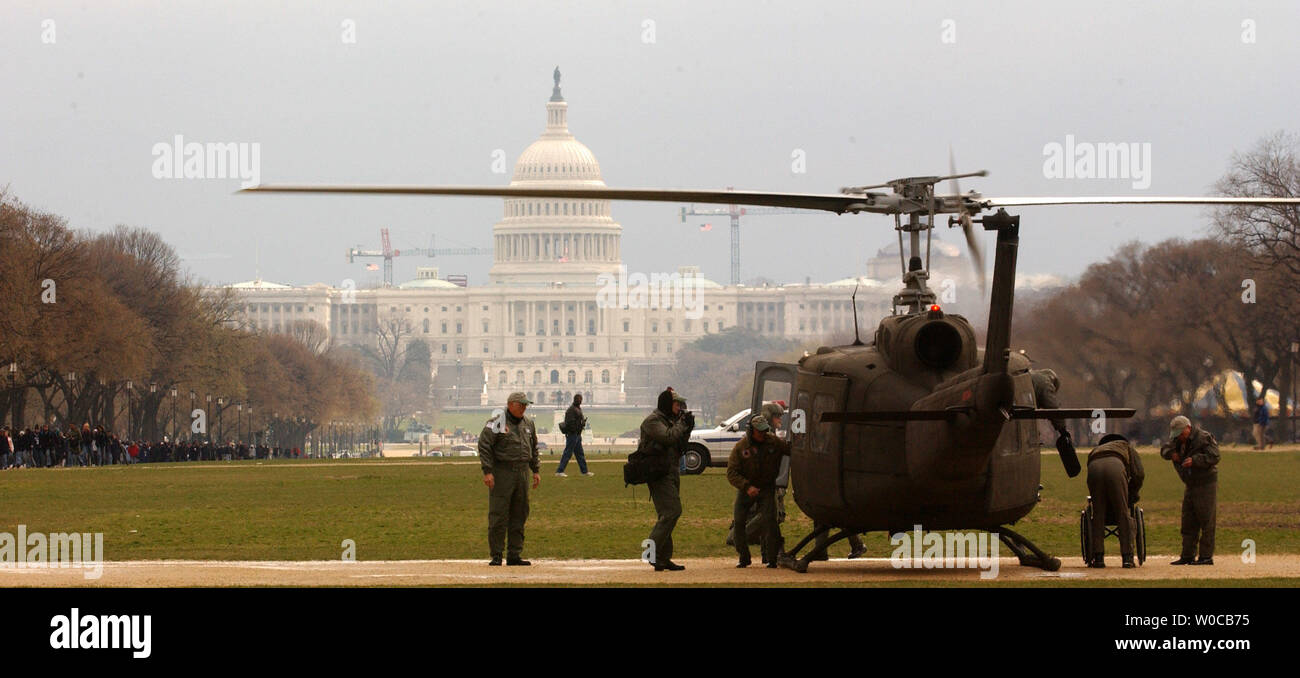 A Vietnam-era Huey helicopter lands on the mall in front of the ...
