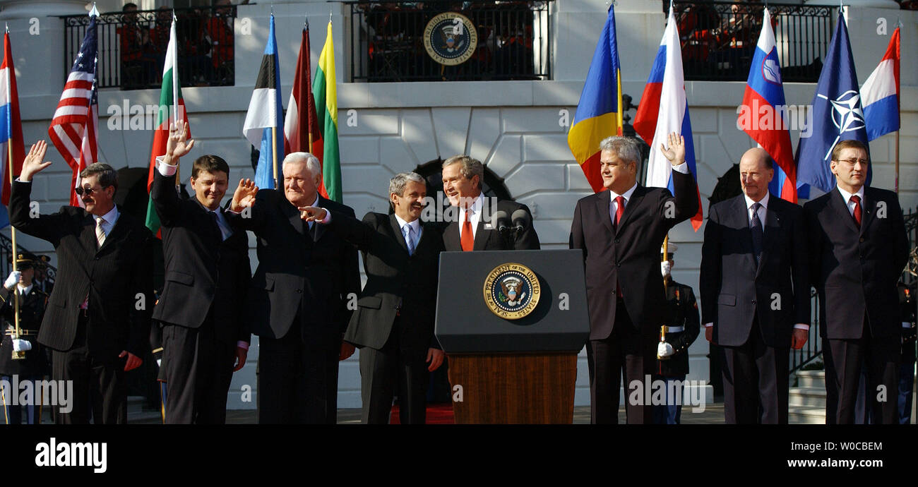 President Bush, center, welcomes seven new members to NATO during a ...