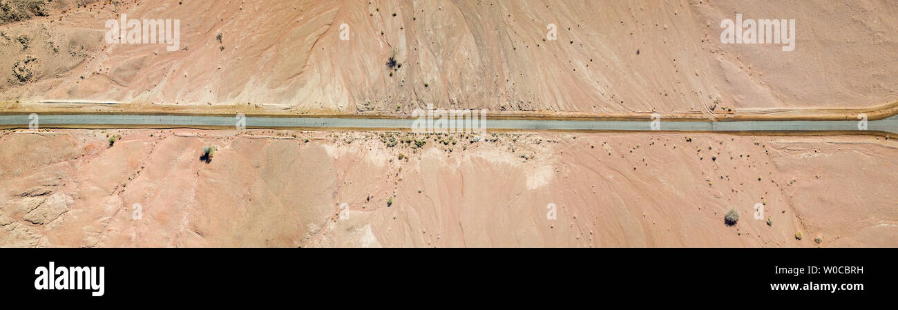 Old Desert road with cracked asphalt, Top down aerial image Stock Photo ...