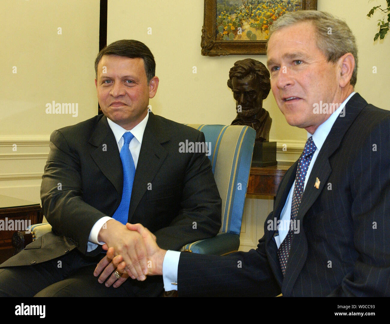 King Abdullah II of Jordan, left, shakes hands with U.S. President ...