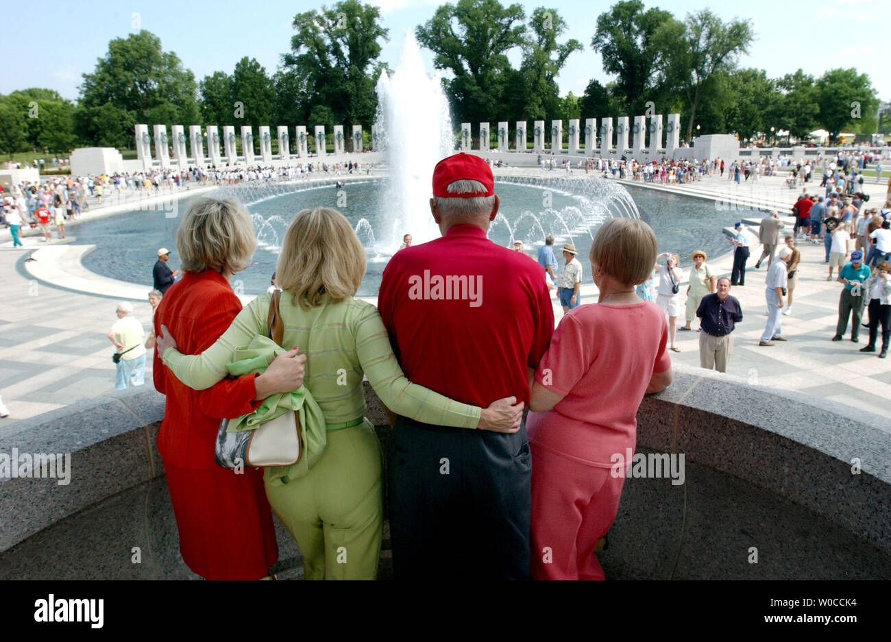Walter F. Bergman, in the red hat, looks out over the new World War II ...