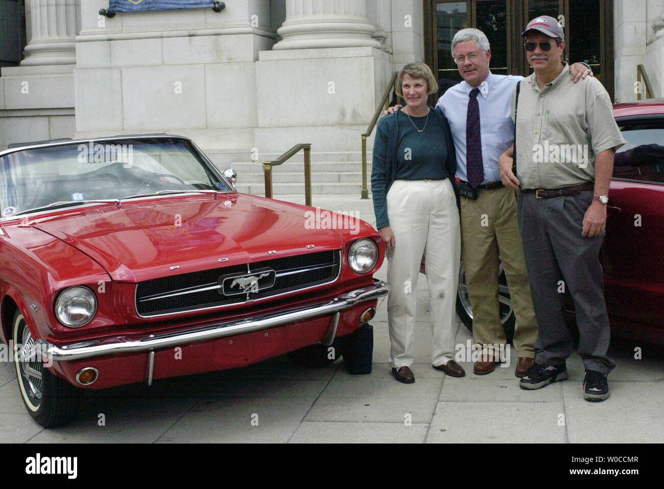 David Williams (center), owns the 1965 Ford Mustang convertible used by ...