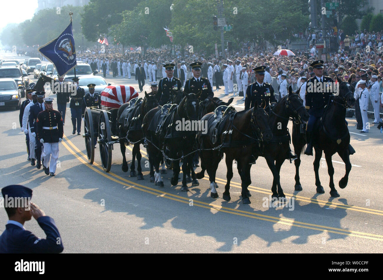 The casket of former President Ronald Reagan proceeds down Constitution ...