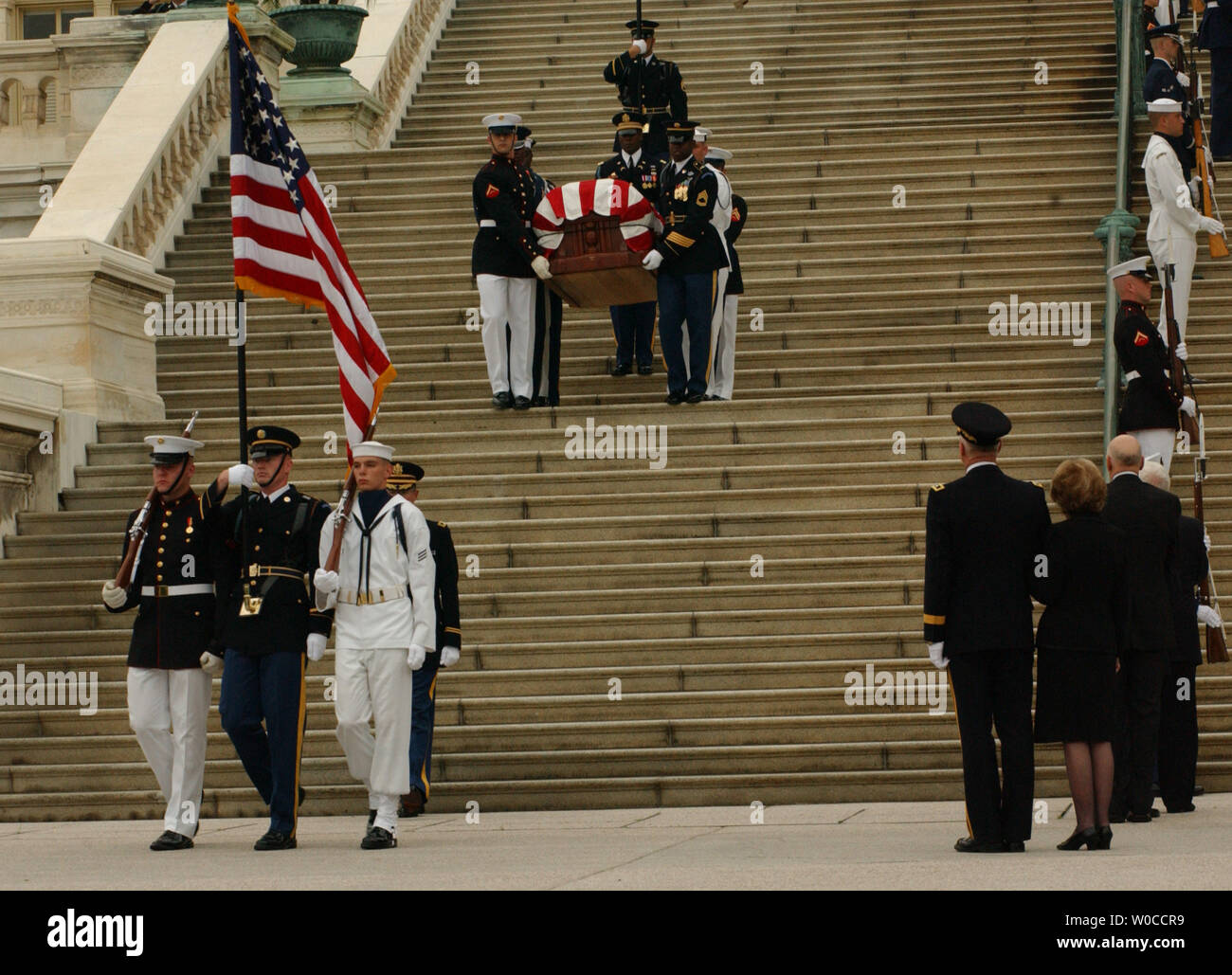 The casket of former President Ronald Reagan is escorted down the steps ...