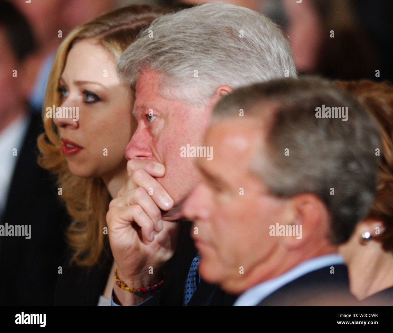 Former President Bill Clinton sits next to President George W. Bush ...