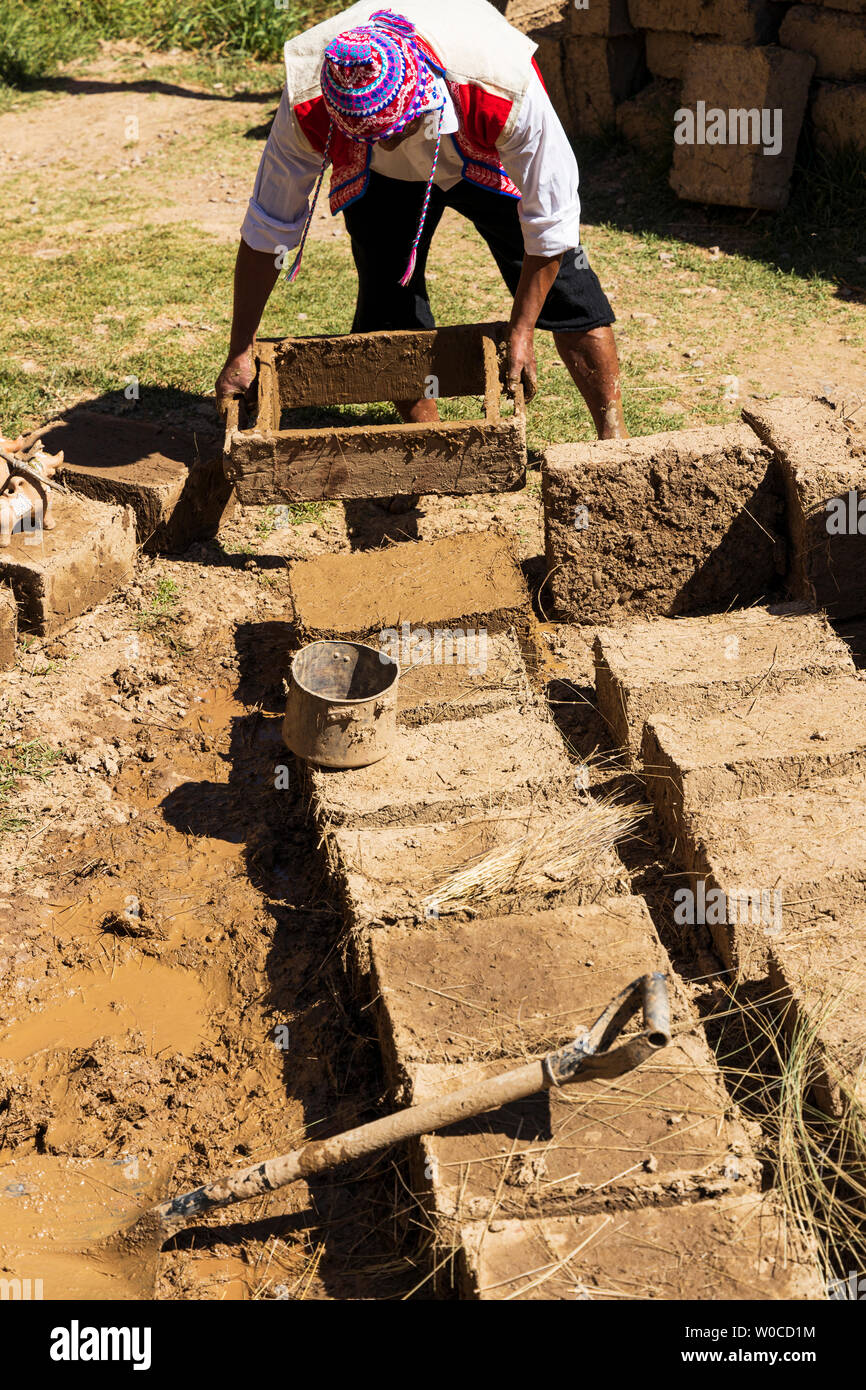 Making adobe mud blocks for building houses, Pisac, Sacred Valley, Peru ...